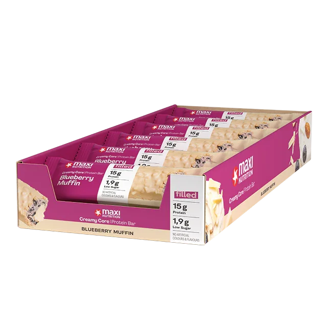 Maxinutrition Creamy Core Protein Bars are stacked full of gooey creamy ...