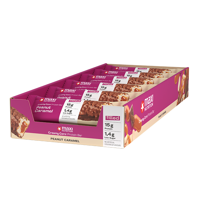 Maxinutrition Creamy Core Protein Bars are stacked full of gooey creamy ...