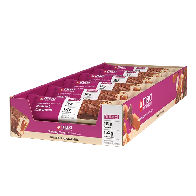 Maxinutrition Creamy Core Protein Bars are stacked full of gooey creamy ...
