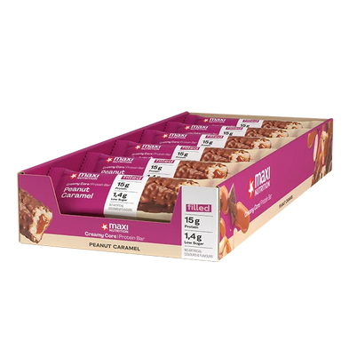 Maxinutrition Creamy Core Protein Bars are stacked full of gooey creamy ...